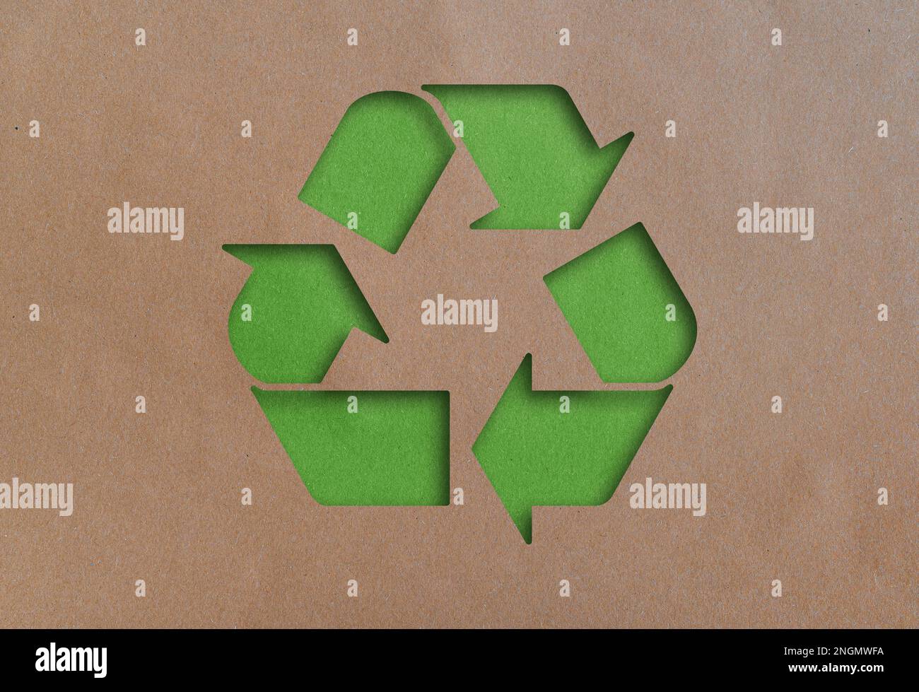 recycling symbol cut out of brown recycled paper Stock Photo - Alamy