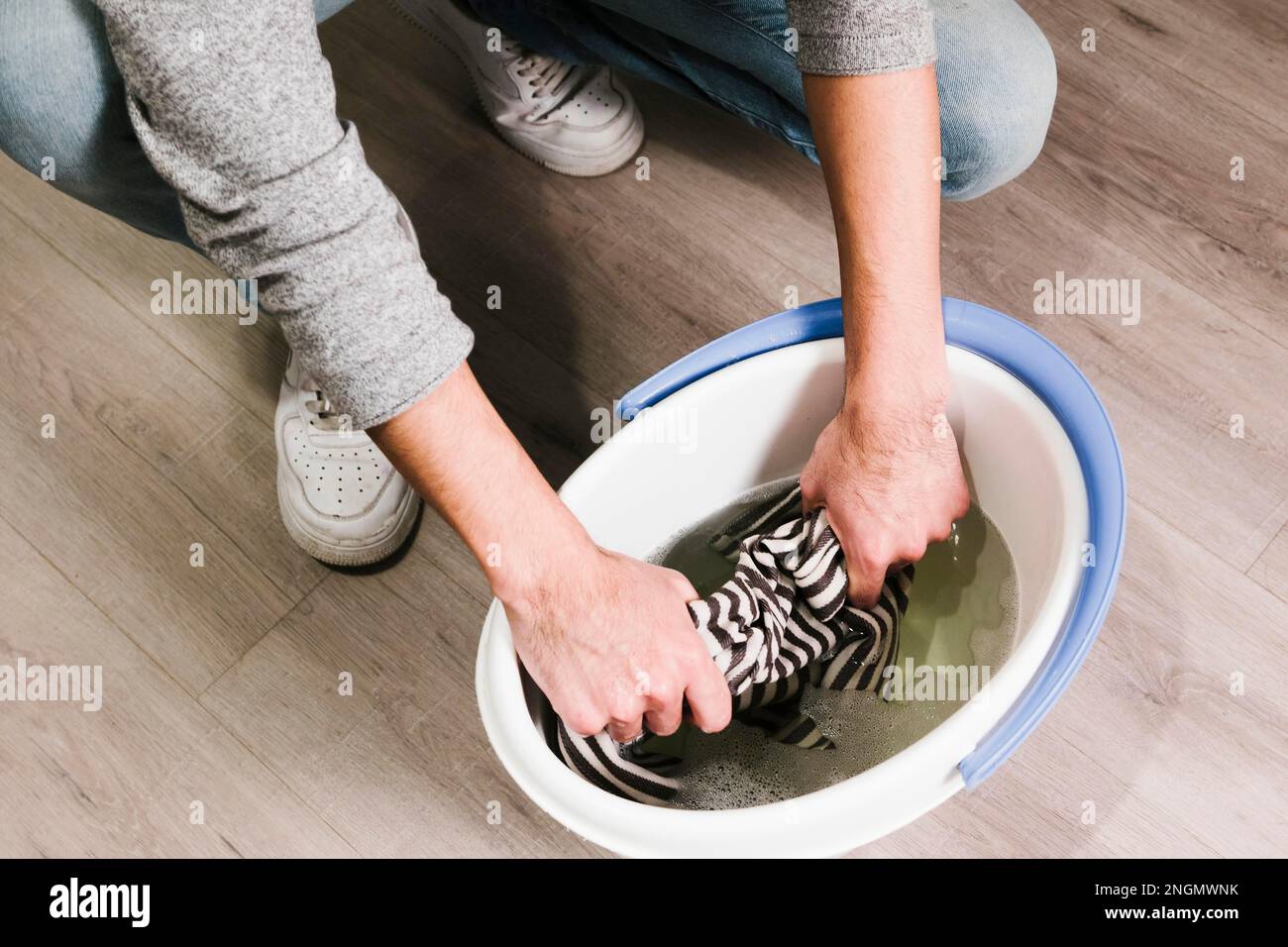 close up man squeezing wet cloth bucket. Beautiful photo Stock Photo ...