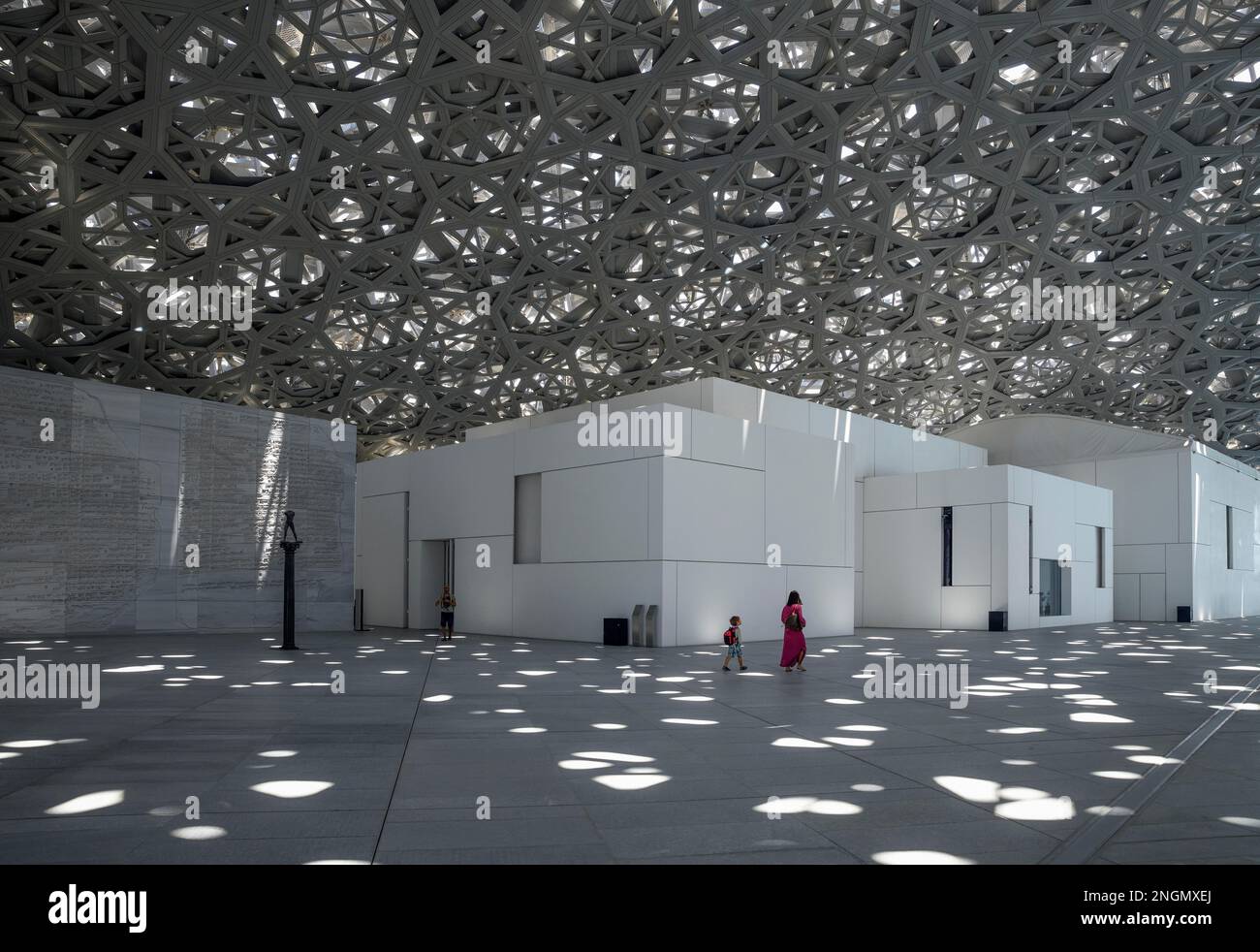 Visitors in the light rain of the Louvre Abu Dhabi, architect Jean ...