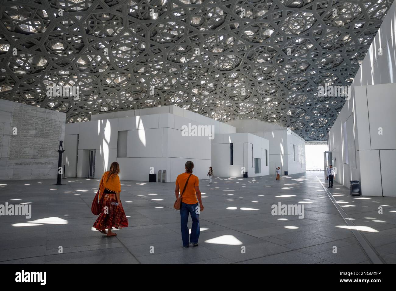 Visitors in the light rain of the Louvre Abu Dhabi, architect Jean ...