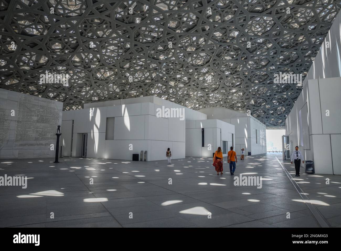 Visitors in the light rain of the Louvre Abu Dhabi, architect Jean ...
