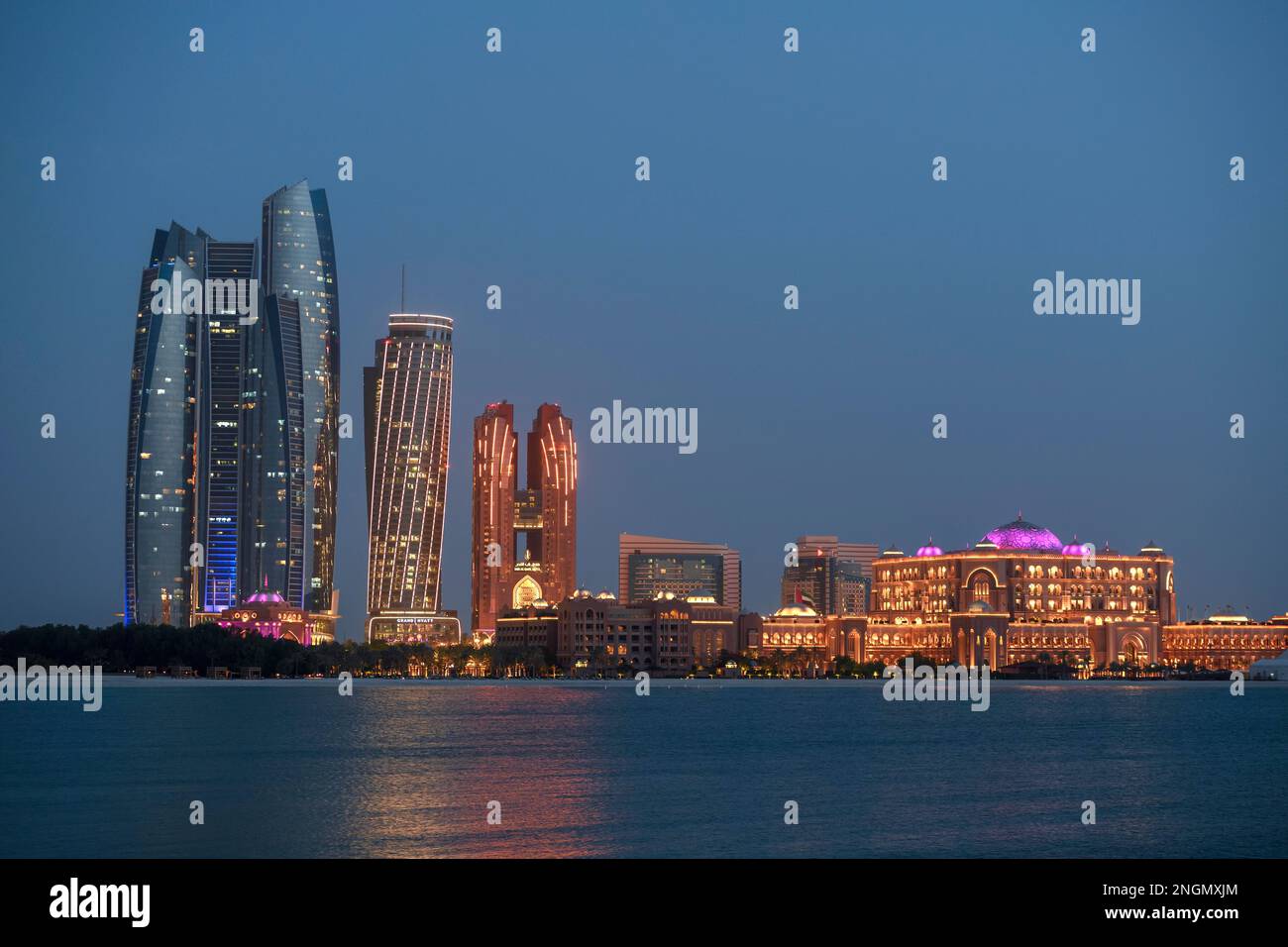 Skyline at dusk, Etihad Towers and Emirates Palace Hotel, Abu Dhabi ...