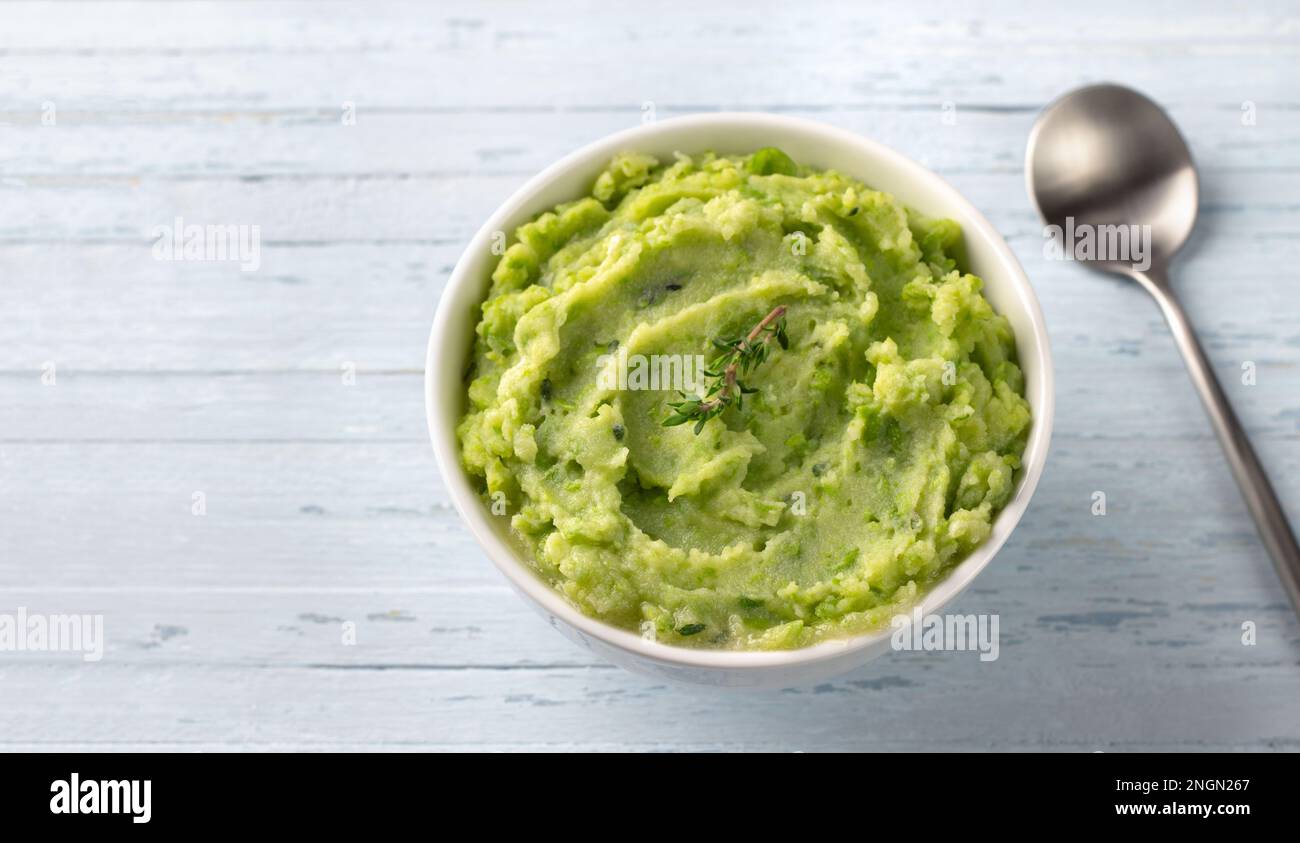 Delicate mashed potatoes with green peas, flavored with butter, spices ...