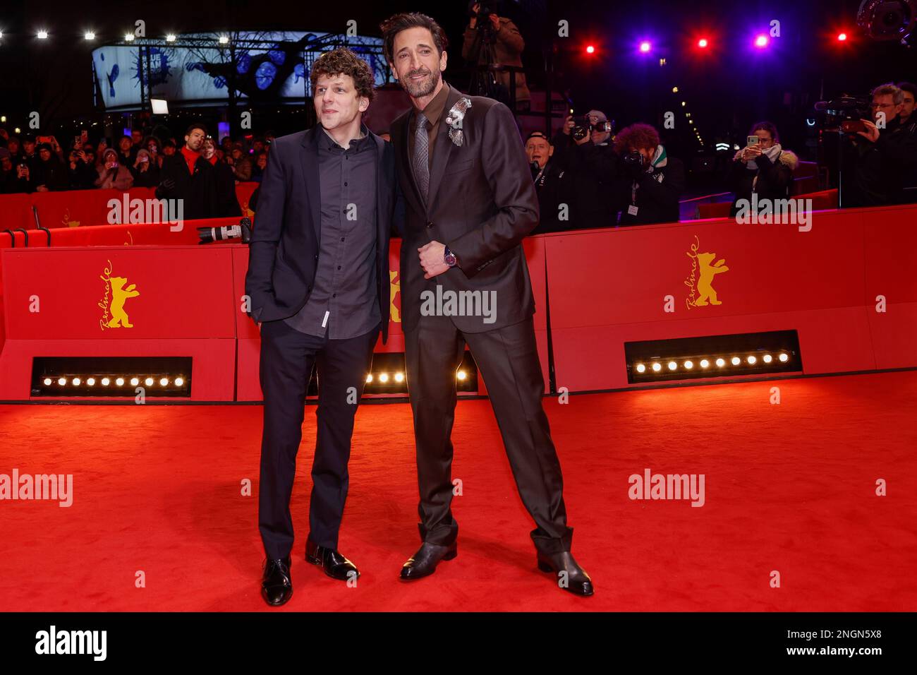 Adrien Brody, right, and Jesse Eisenberg pose for photographers at the ...