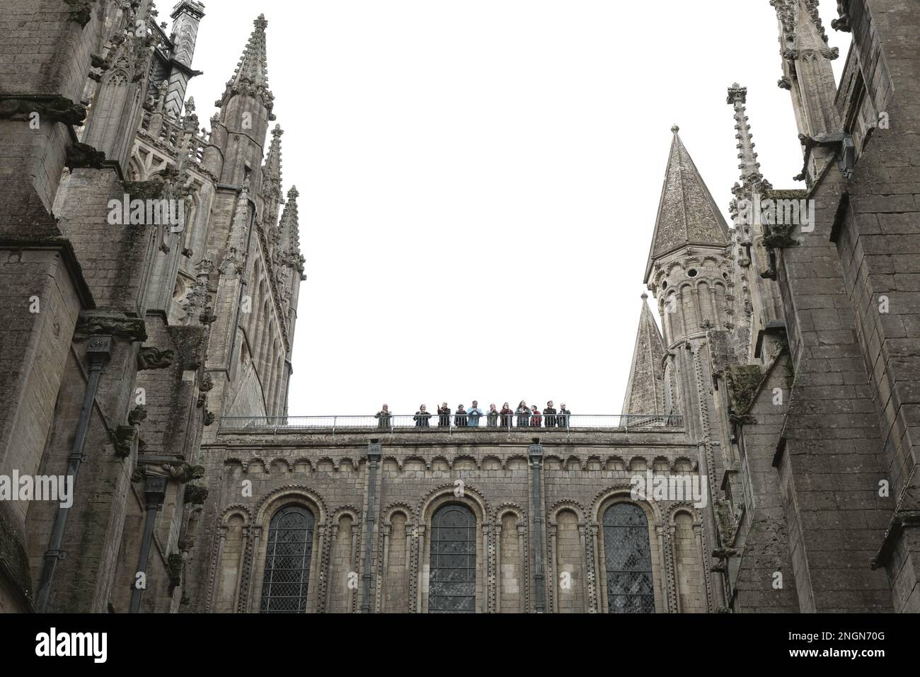 Group of tourists on a guided tour seen on a balcony of the famous Ely ...