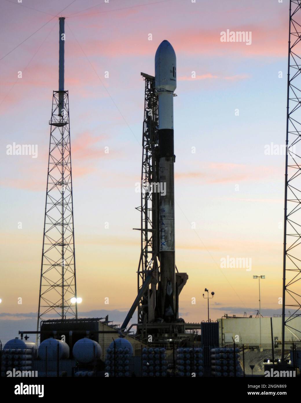 A SpaceX Falcon 9 rocket stands on Complex 40 at dusk as it is prepared ...