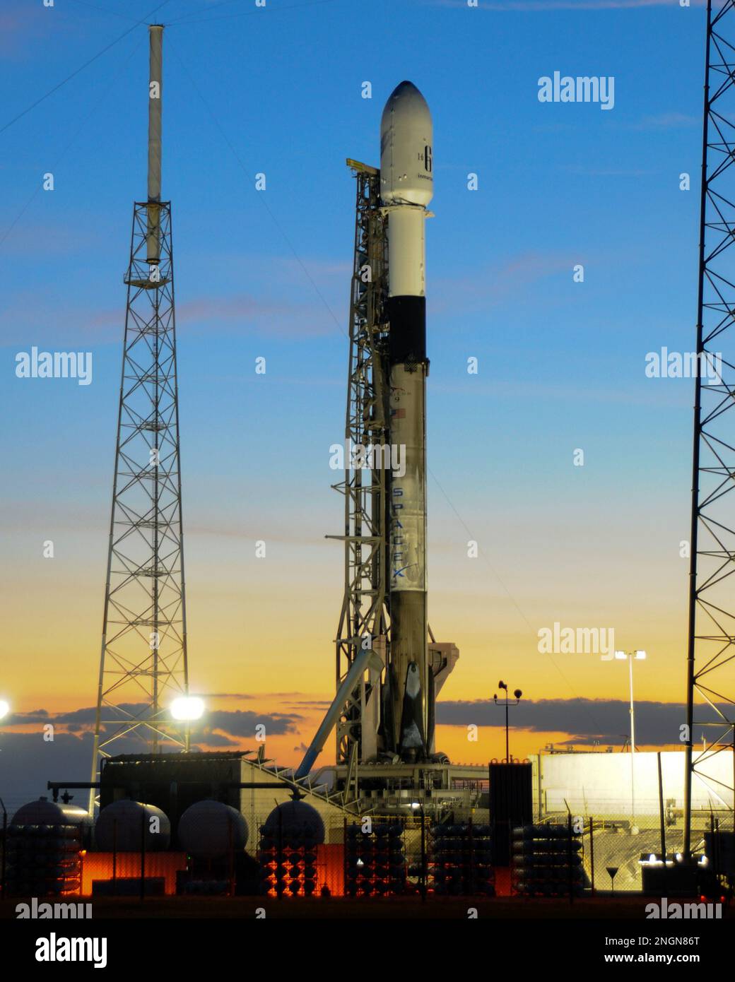 A SpaceX Falcon 9 rocket stands on Complex 40 at dusk as it is prepared ...