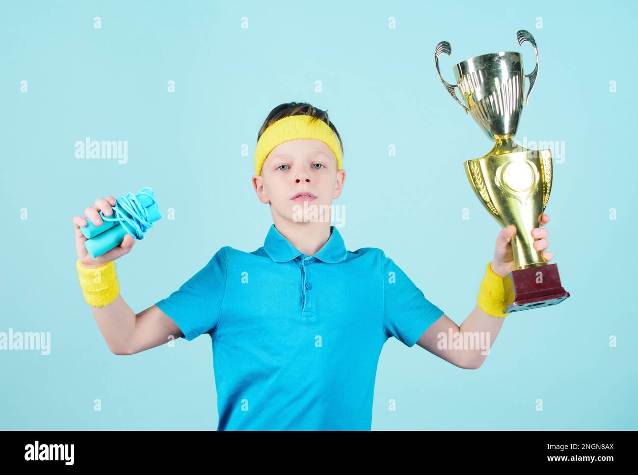 Happy child sportsman hold champion cup trophy. Fitness and diet ...