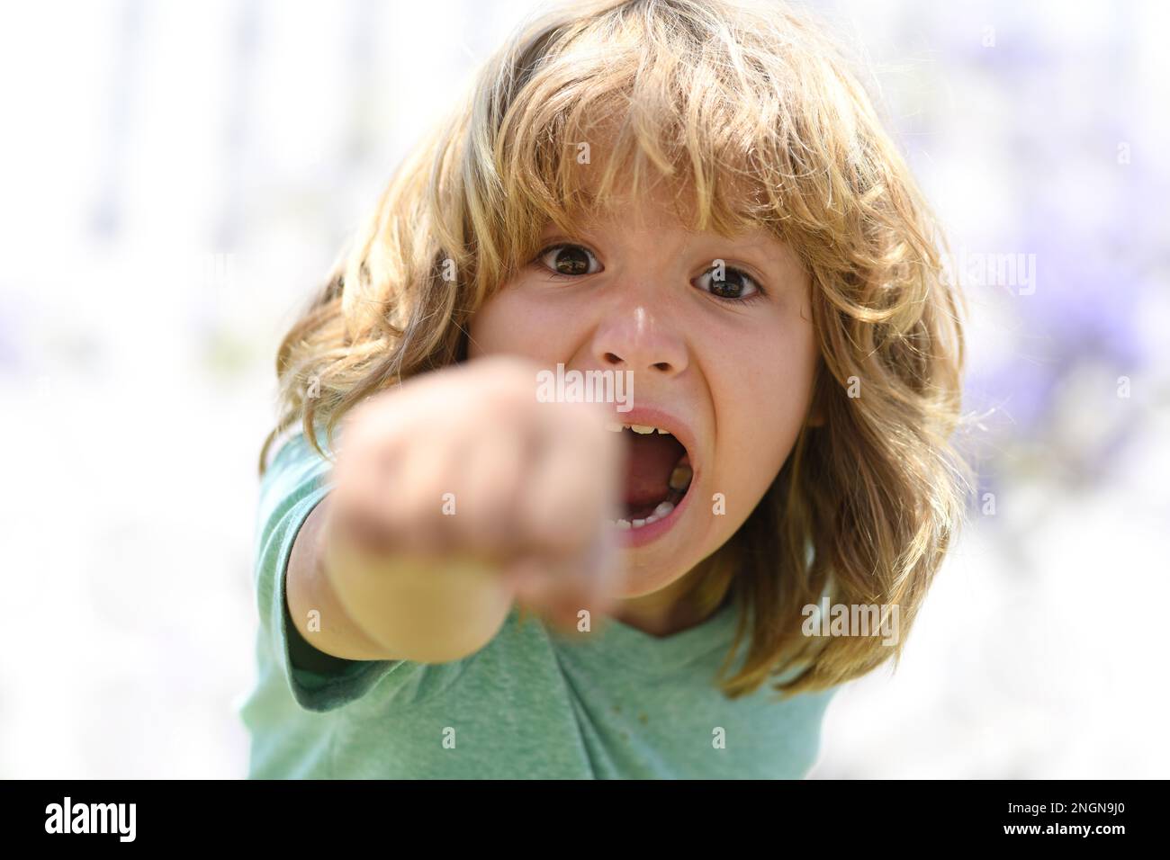 Enraged kid boy with angry expression. Angry hateful little rage boy ...