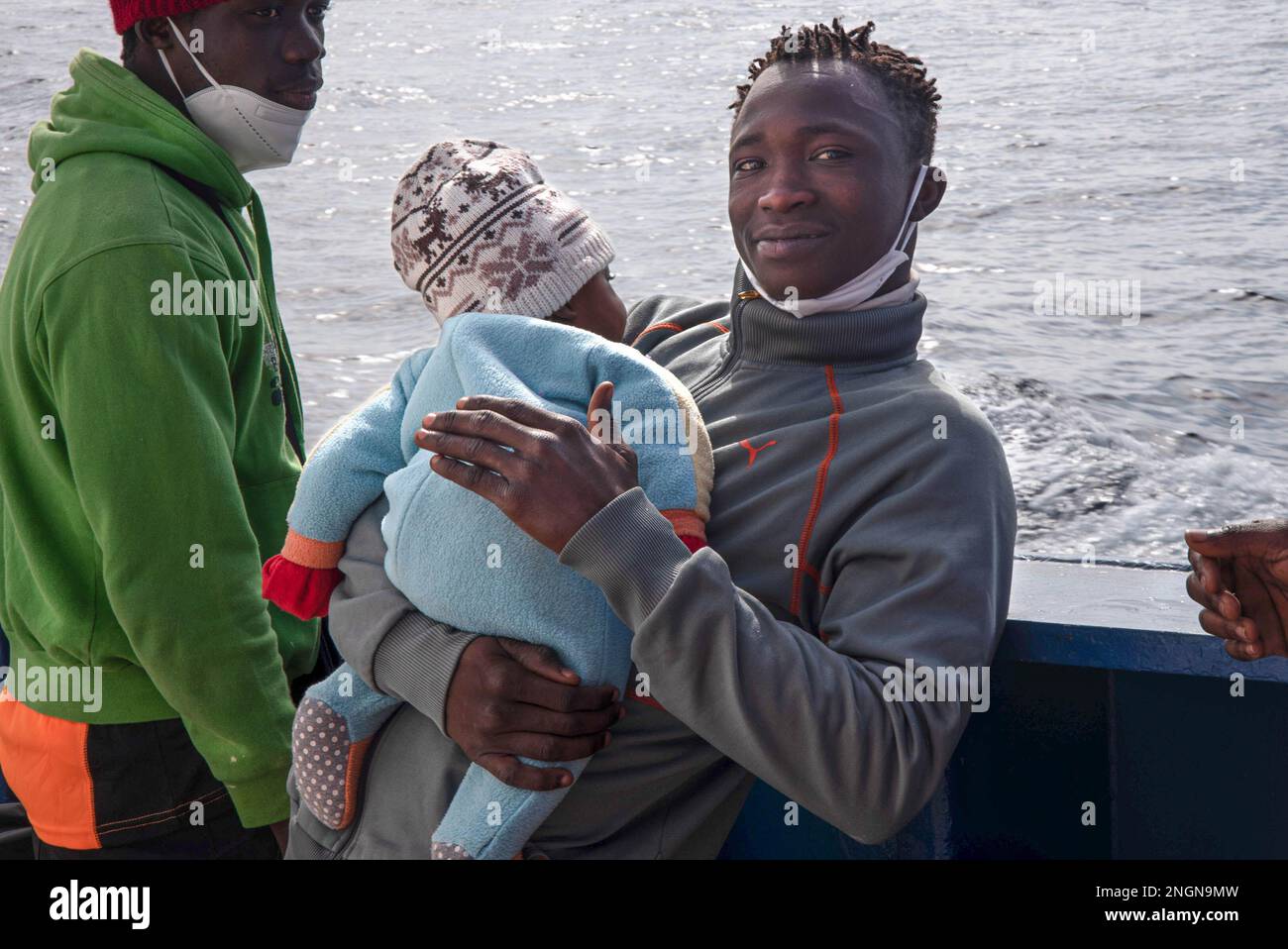 15-year-old KontÈ holds a three-month-old baby girl during their three ...