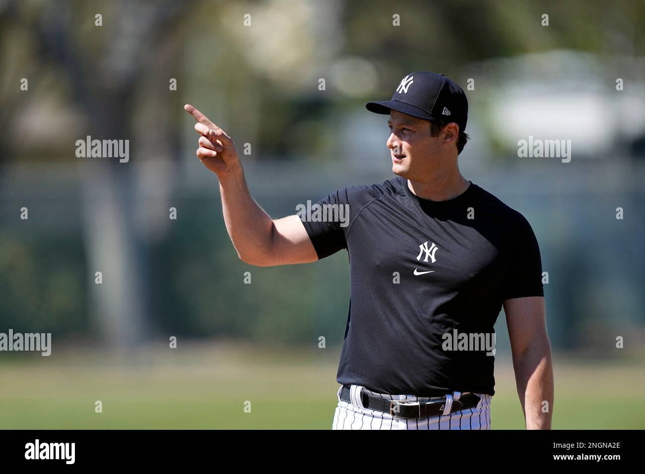 New York Yankees pitcher Gerrit Cole points to another field during a ...