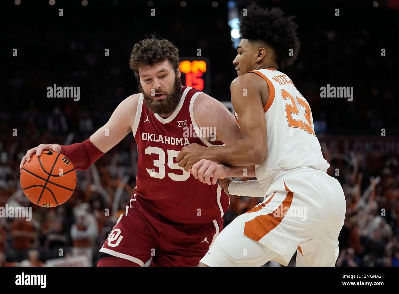 Oklahoma forward Tanner Groves (35) drives around Texas forward Dillon ...
