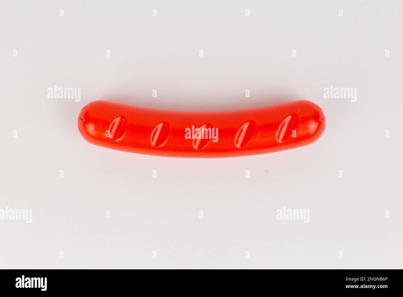 a plastic sausage grill children's toy on a white background Stock ...