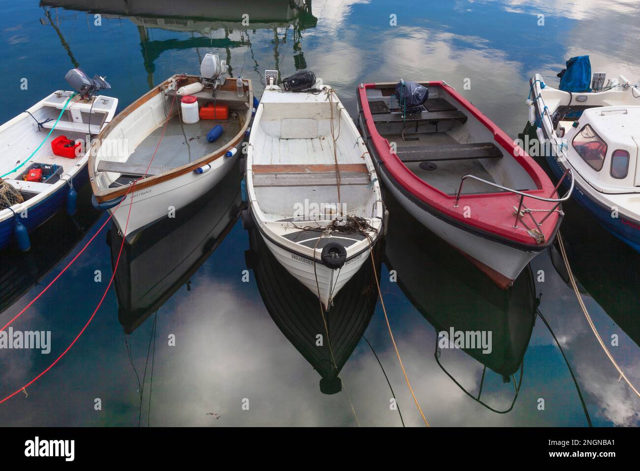 Little boats lined up in Porthleven Harbour Stock Photo - Alamy