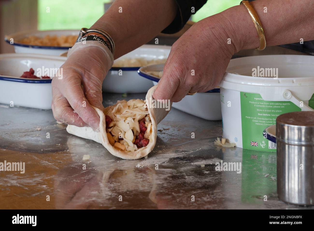 Ann from Ann's Pasties making a traditional Cornish Pasty at Porthleven ...