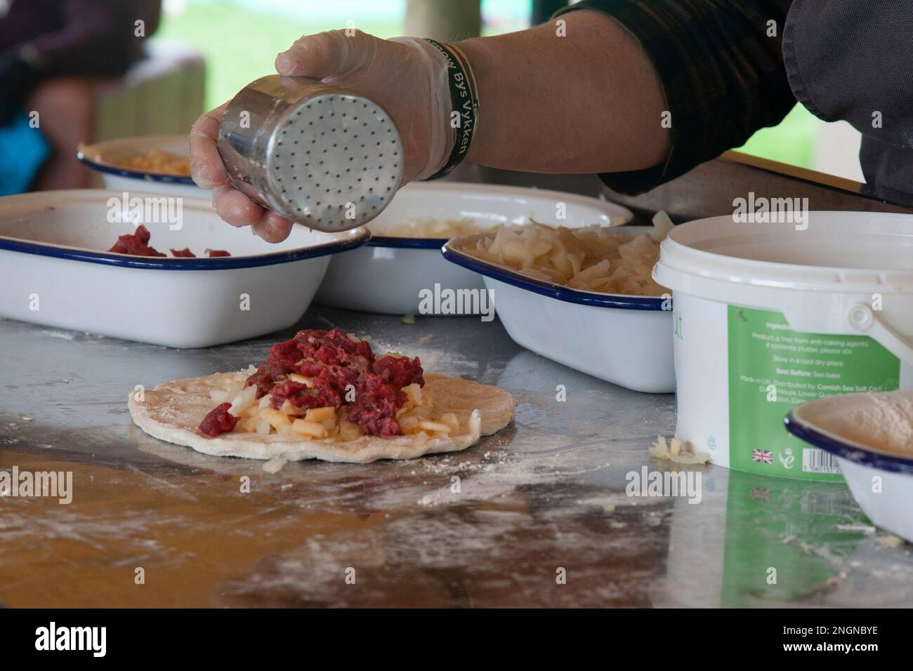 Ann from Ann's Pasties making a traditional Cornish Pasty at Porthleven ...