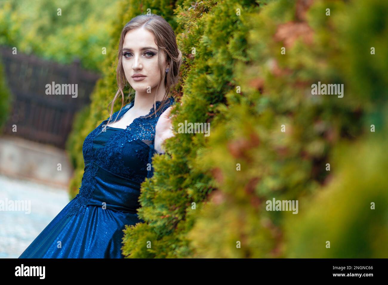 Beautiful girl in glamorous ultramarine dress. Ready for her prom night ...