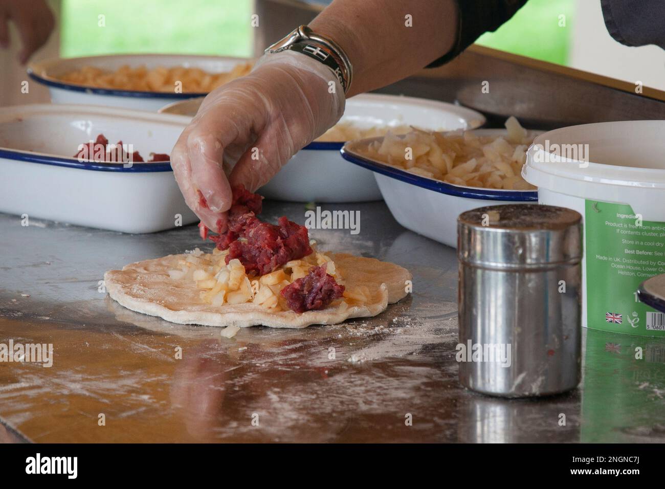 Ann from Ann's Pasties making a traditional Cornish Pasty at Porthleven ...
