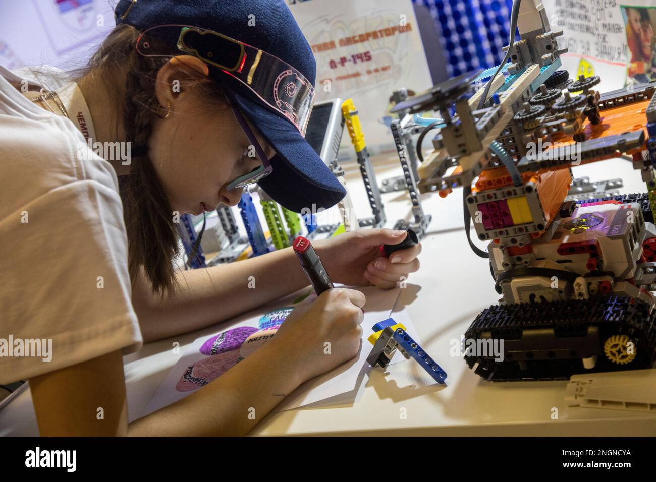 Moscow, Russia. 18th of February, 2023. Participiant is programming a ...
