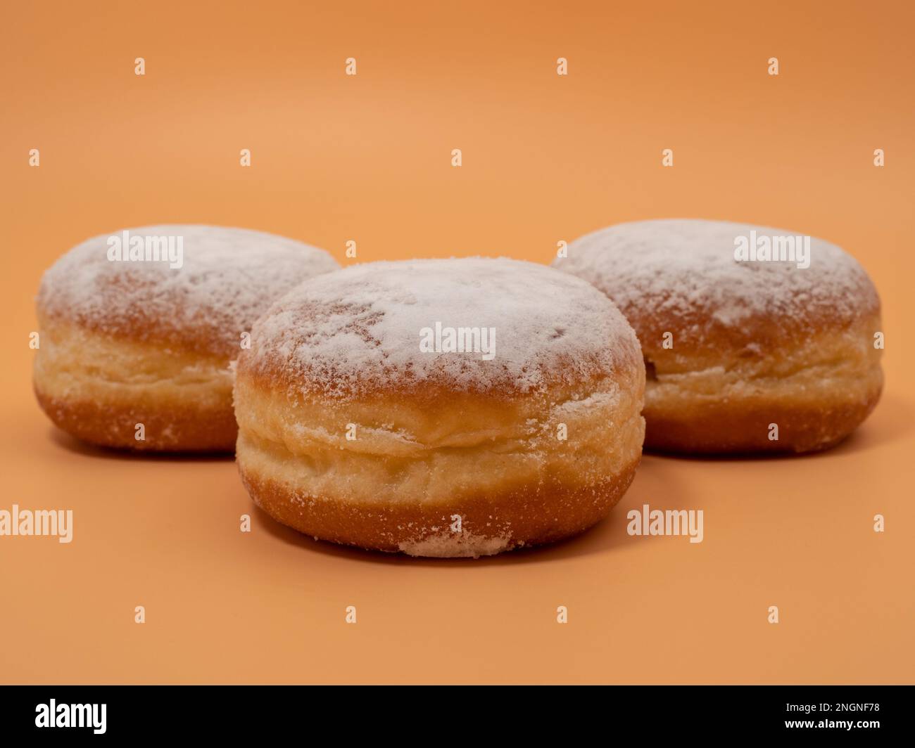 Freshly baked and dusted with powdered sugar German donuts. Donut ...