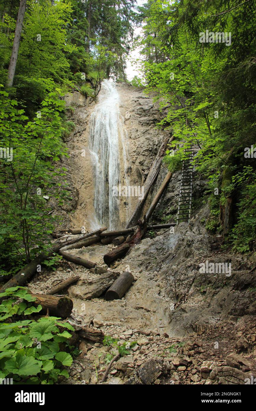 Dangerous trail through a waterfall with steel ladders in the Slovak ...