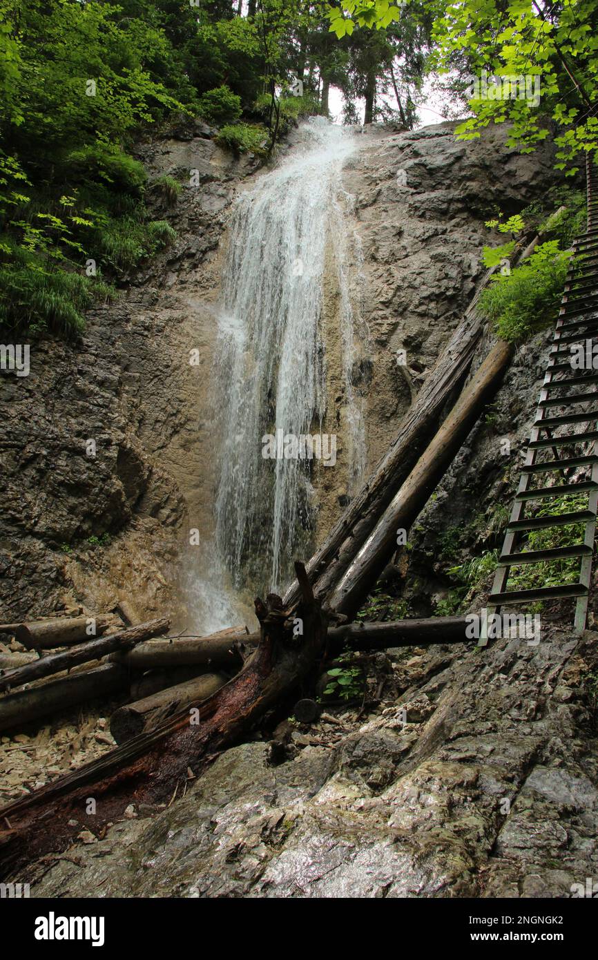 Dangerous trail through a waterfall with steel ladders in the Slovak ...