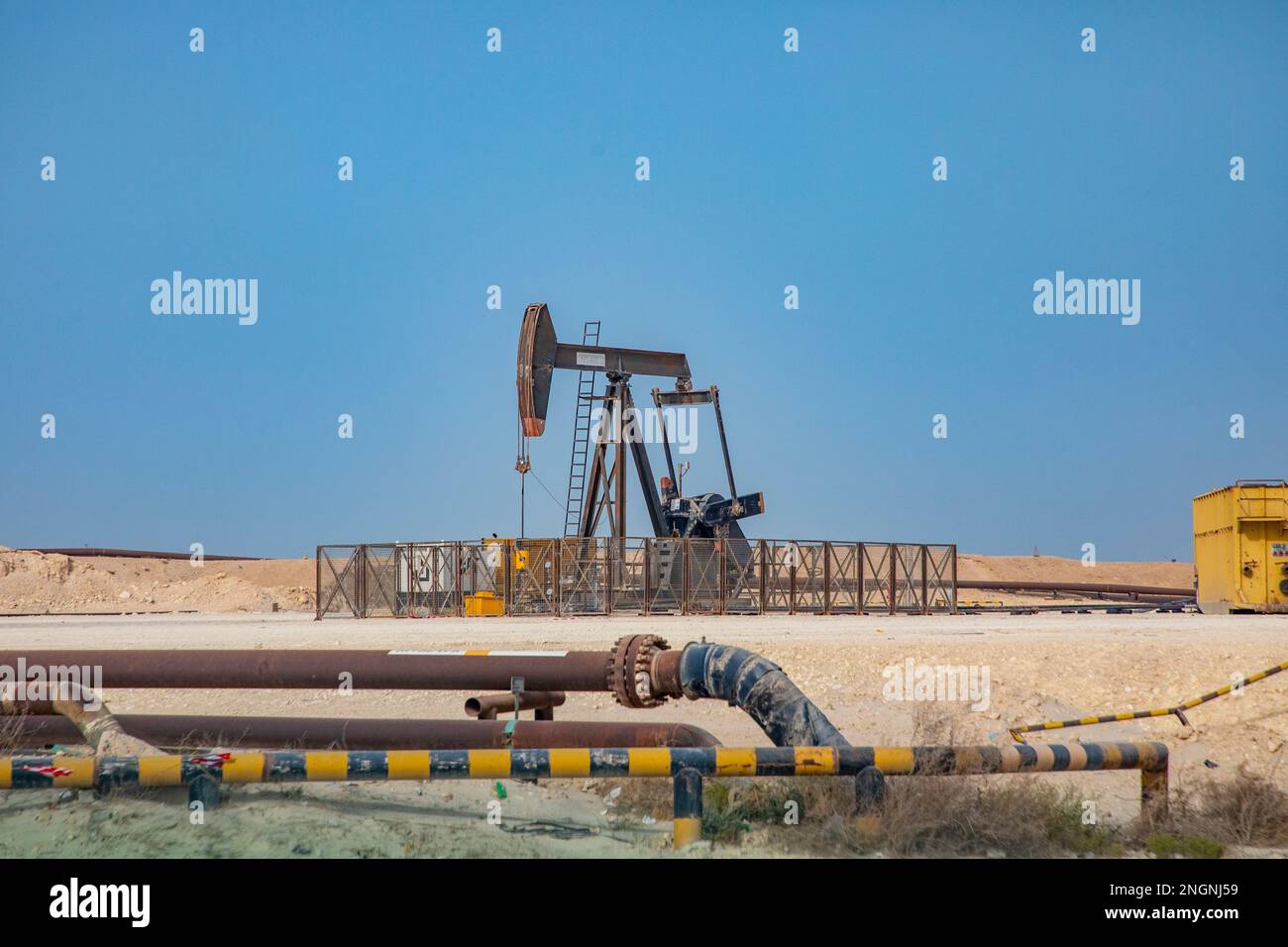 Pumpjack aka oil horse, nodding donkey, oil jack, beam pump raises crude oil in the Bahrain ...