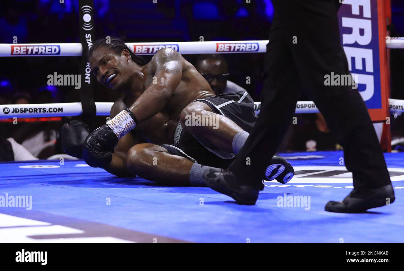 Israel Duffus after being knocked down by Cheavon Clarke in action ...