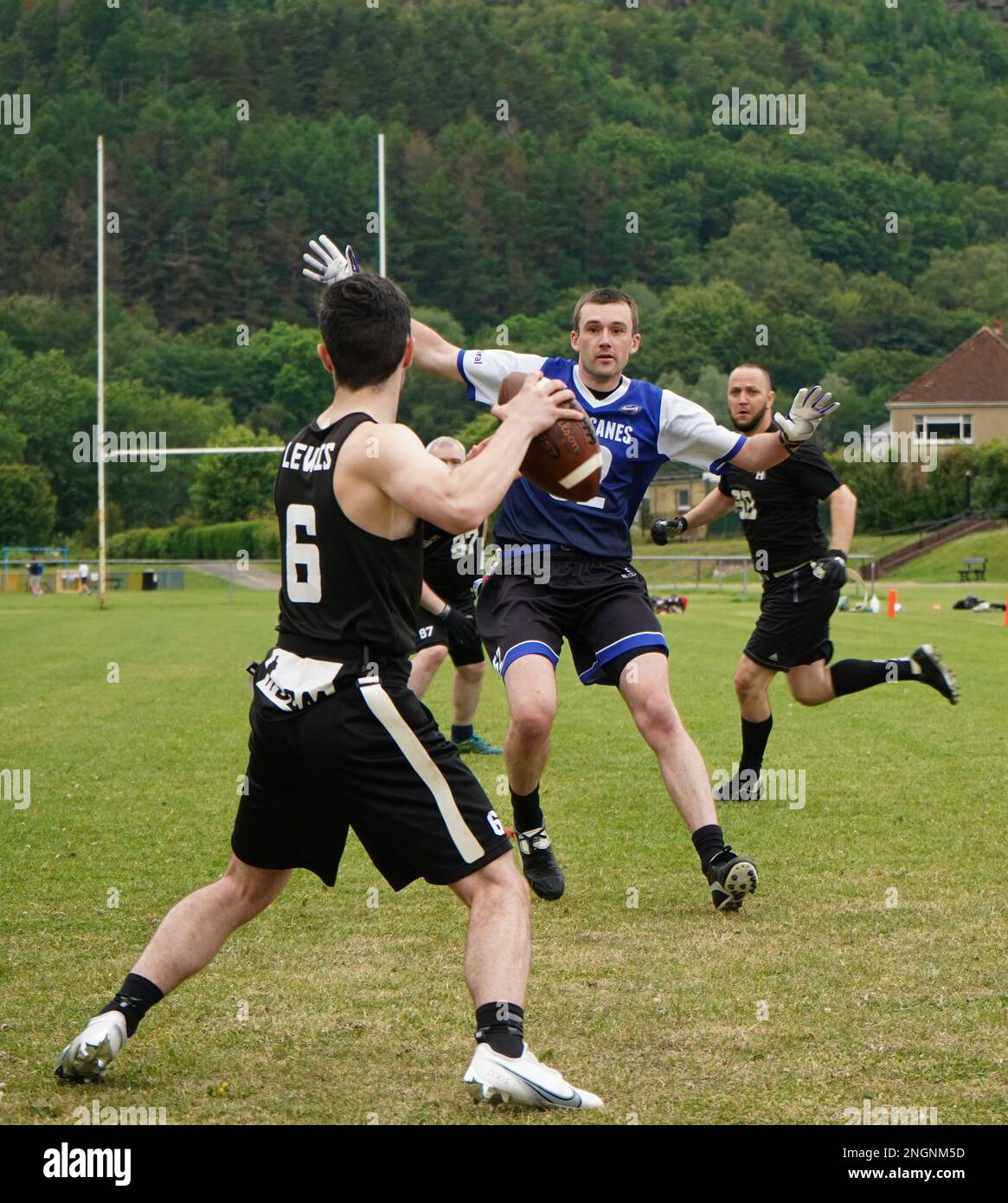 Rusher pressuring the Quaterback during a Flag Football game in Wales ...