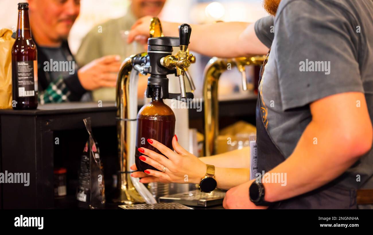 Golden beer poured plastic bottle hi-res stock photography and images ...