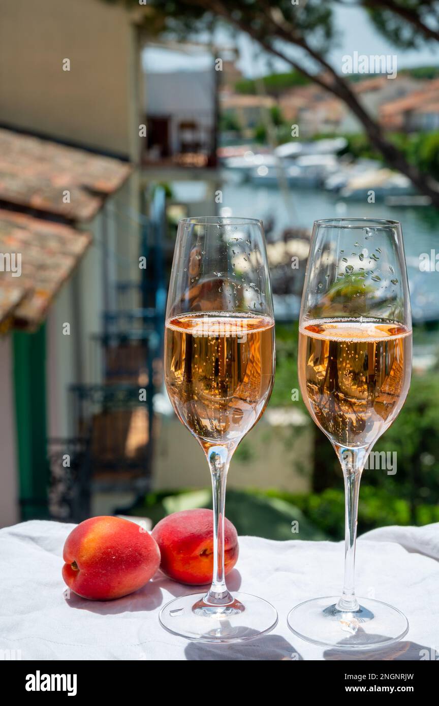 Summer party, drinking of French brut rose champagne sparkling wine in ...