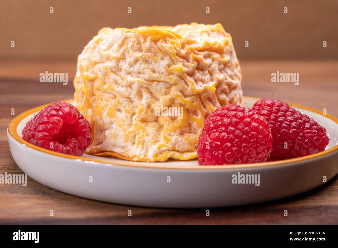 French Langres soft cows crumbly cheese with washed rind structure made ...