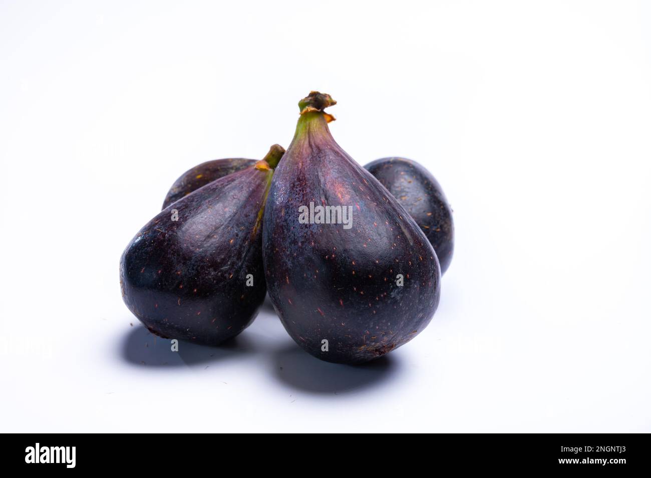 Fresh ripe purple organic figs fruits ready to eat close up isolated on ...
