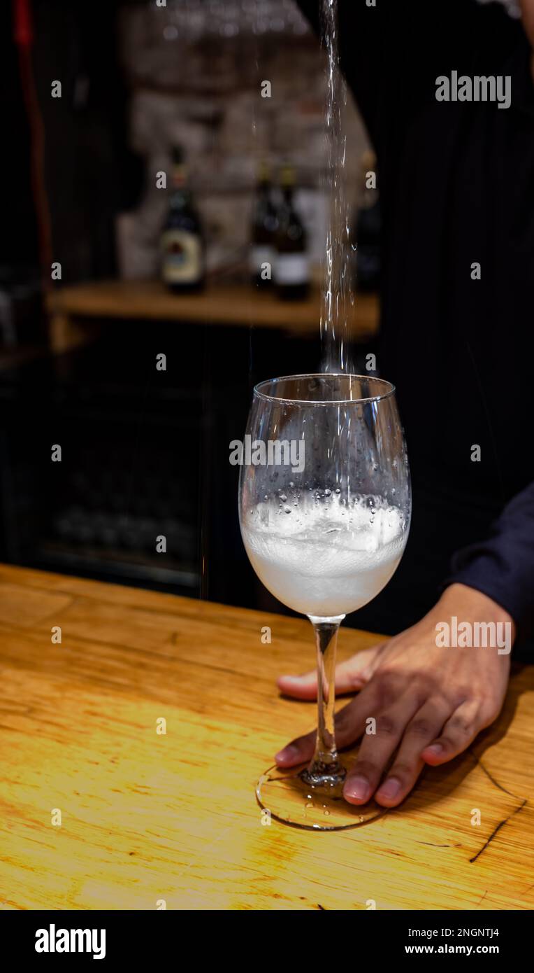 Pouring of txakoli or chacolí slightly sparkling very dry white wine ...