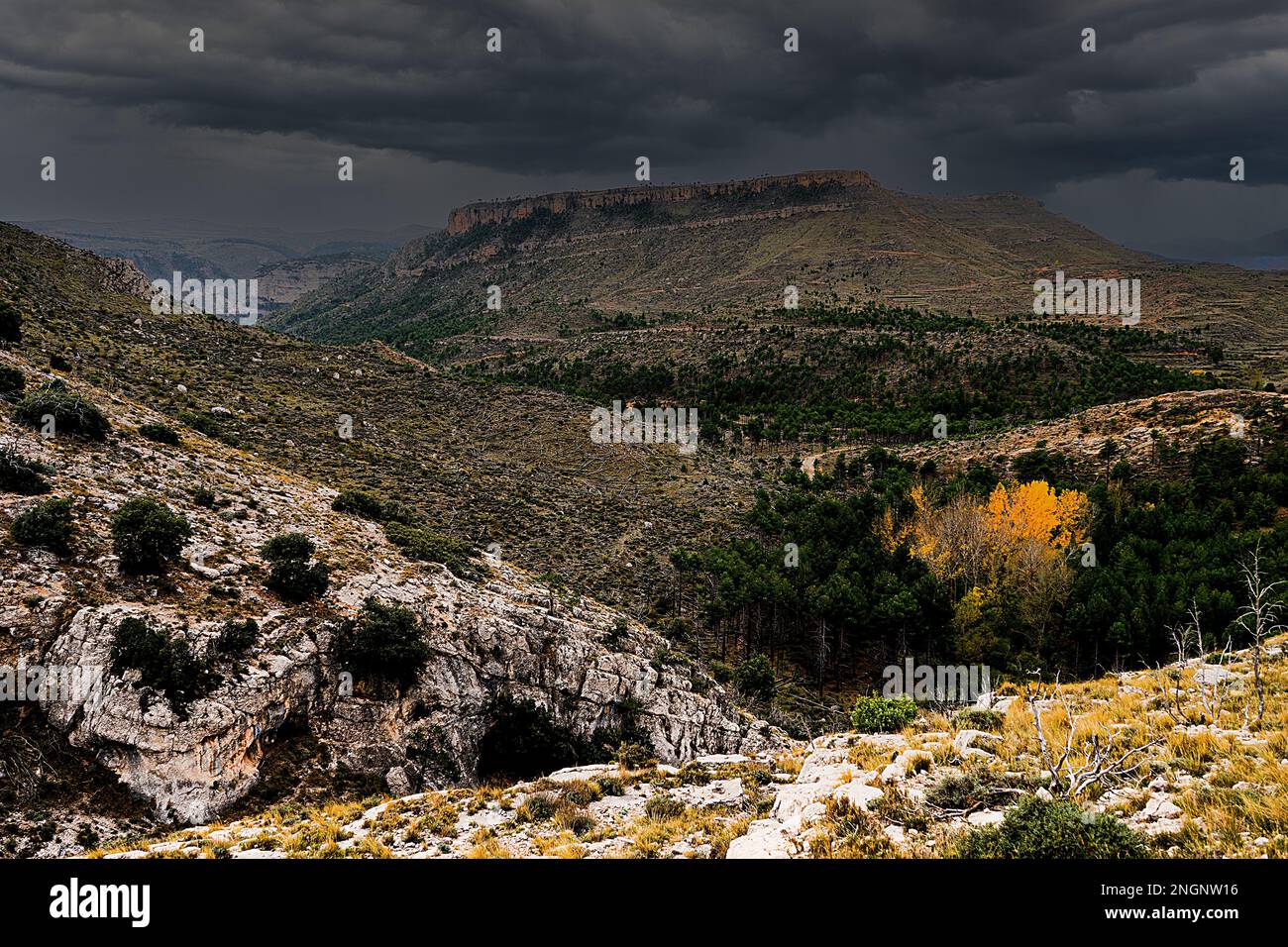 Rain clouds over the table mountains in the Aliaga desert in Spain ...