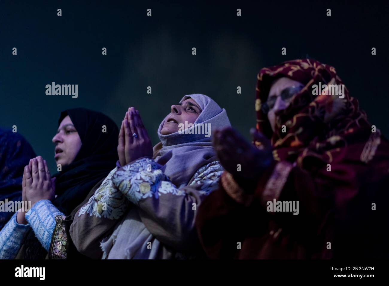 Muslim women devotees raise hands as they pray outside Hazratbal Shrine ...