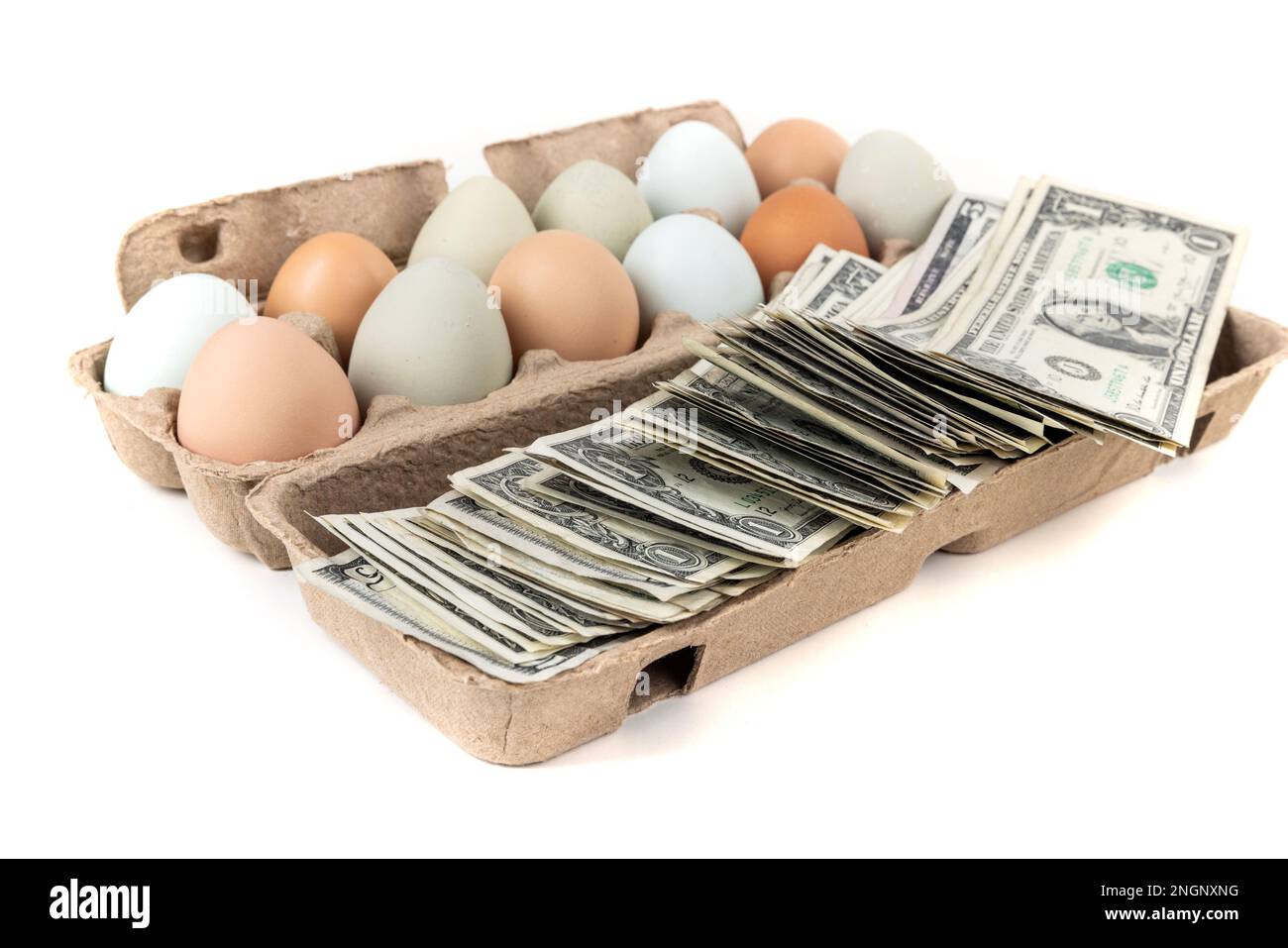 Multicolored farm fresh eggs in a brown egg carton with american money ...