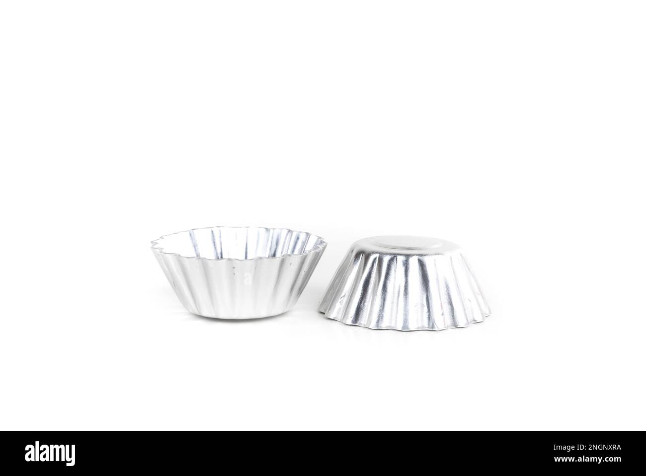 Two pie tins arranged face up and down side view isolated over white ...