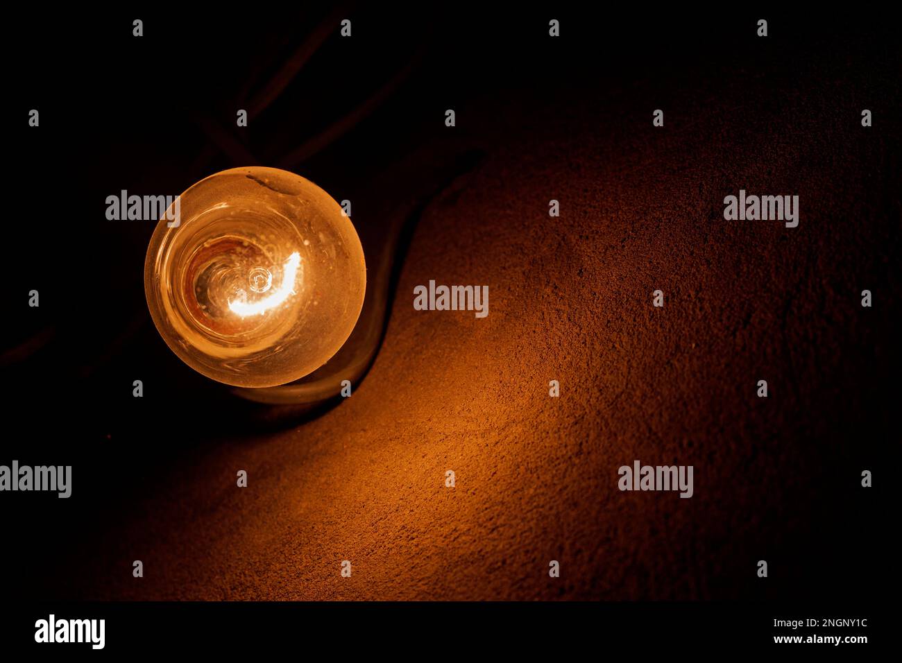 dimly lit electric light bulb. Electricity Stock Photo - Alamy