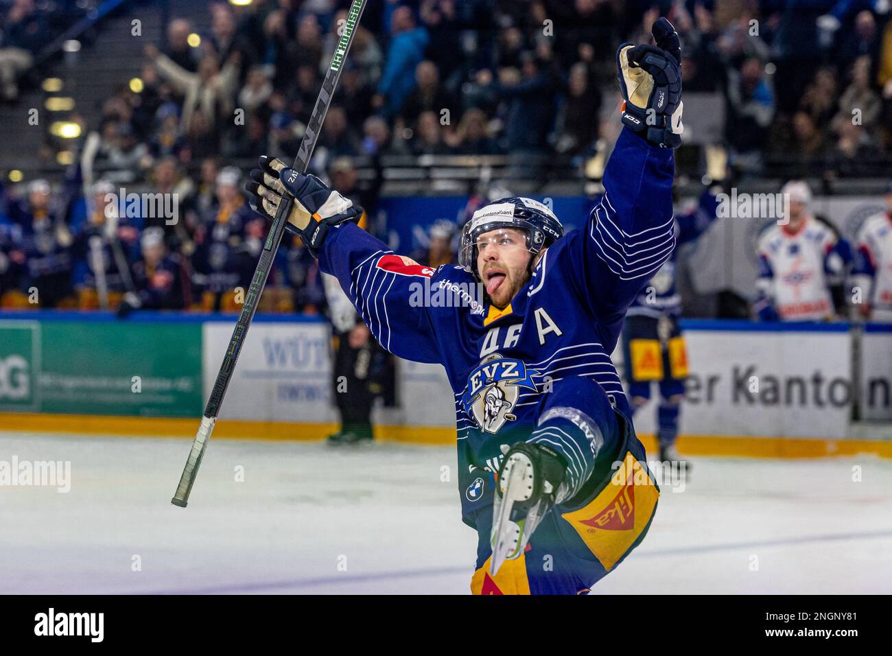 Lino Martschini #46 (EV Zug) celebrates his hat trick and the game ...