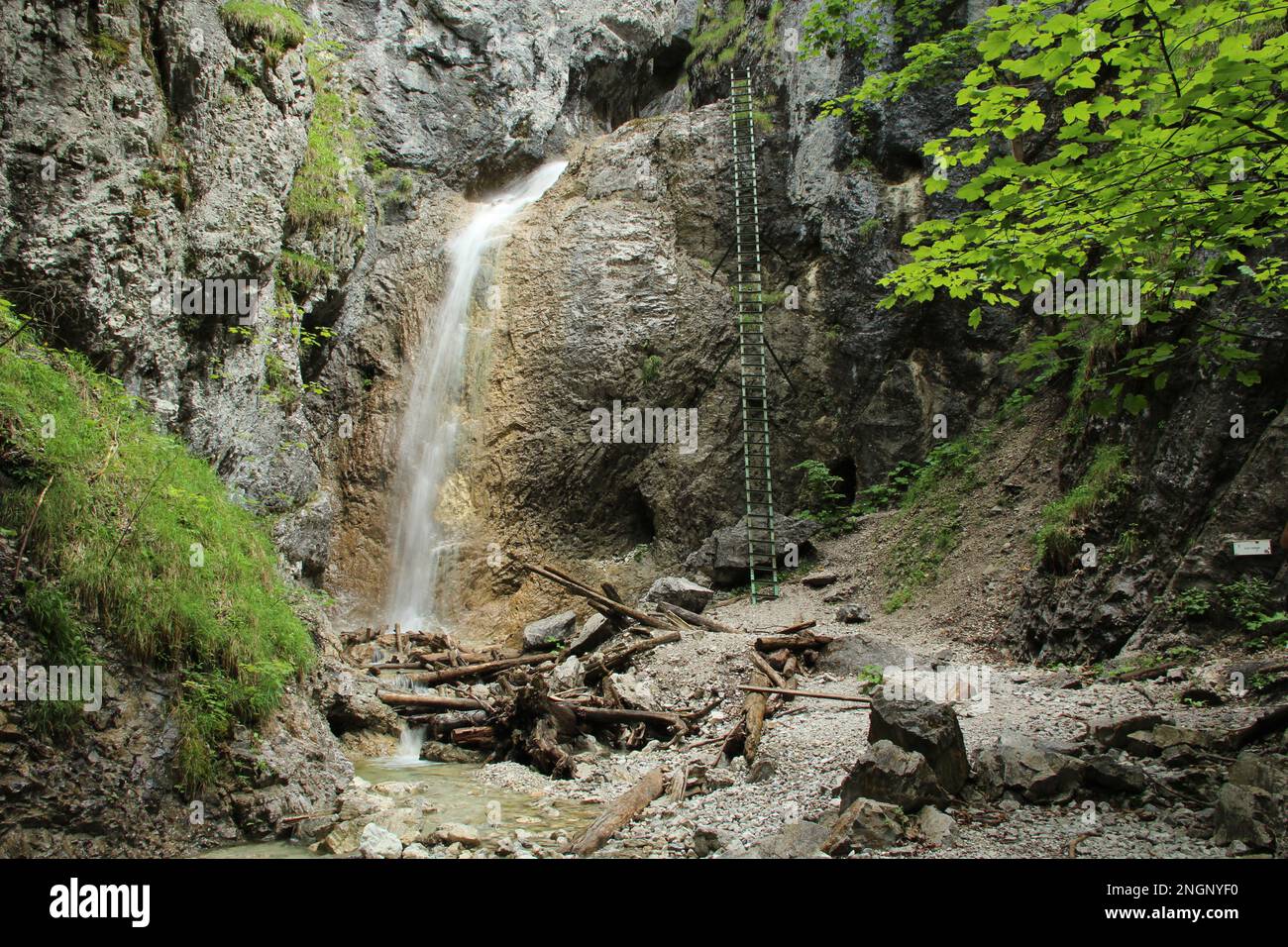 Dangerous trail through a waterfall with steel ladders in the Slovak ...