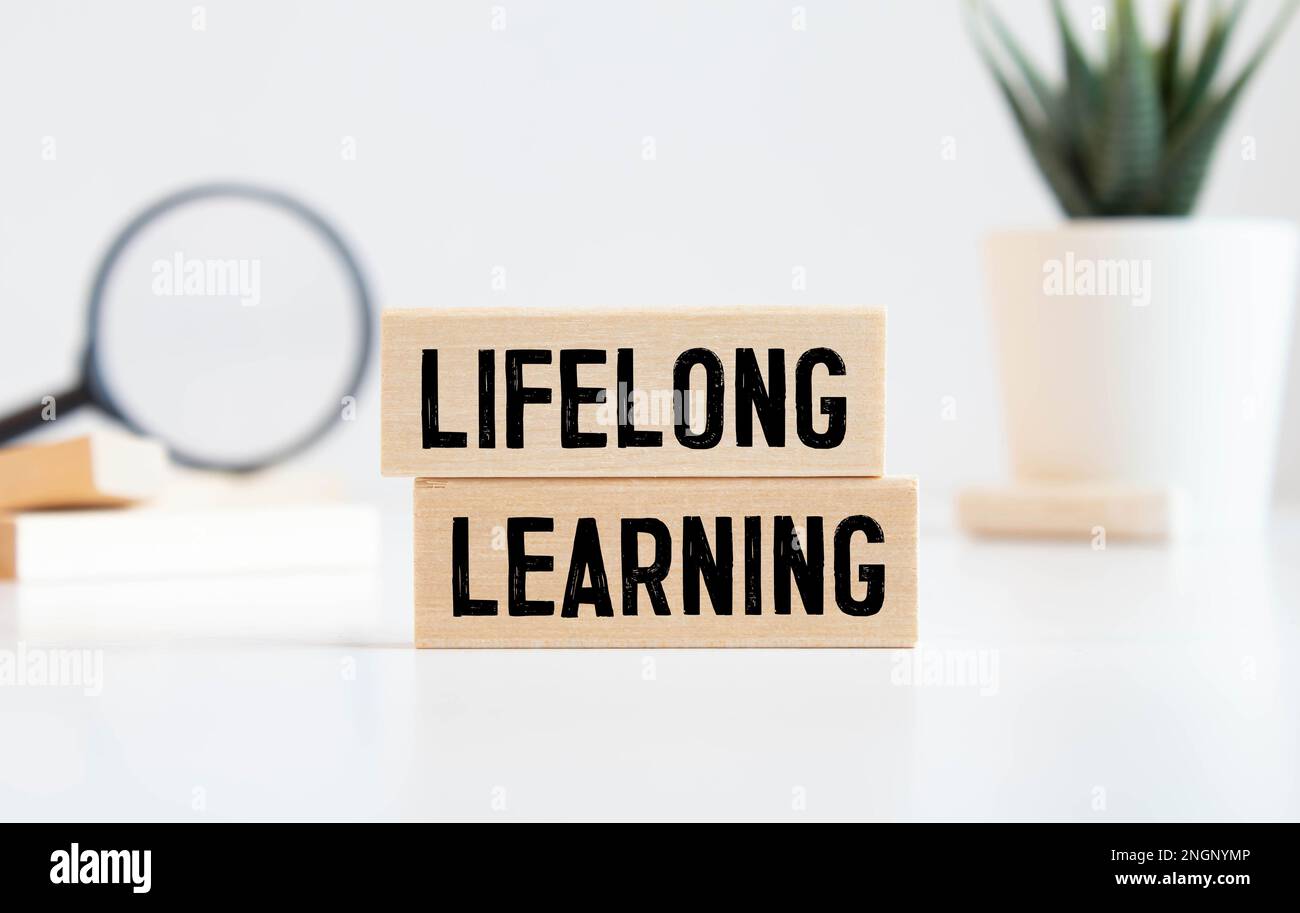 Finance concept.Text Lifelong learning on colorful paper note with ...