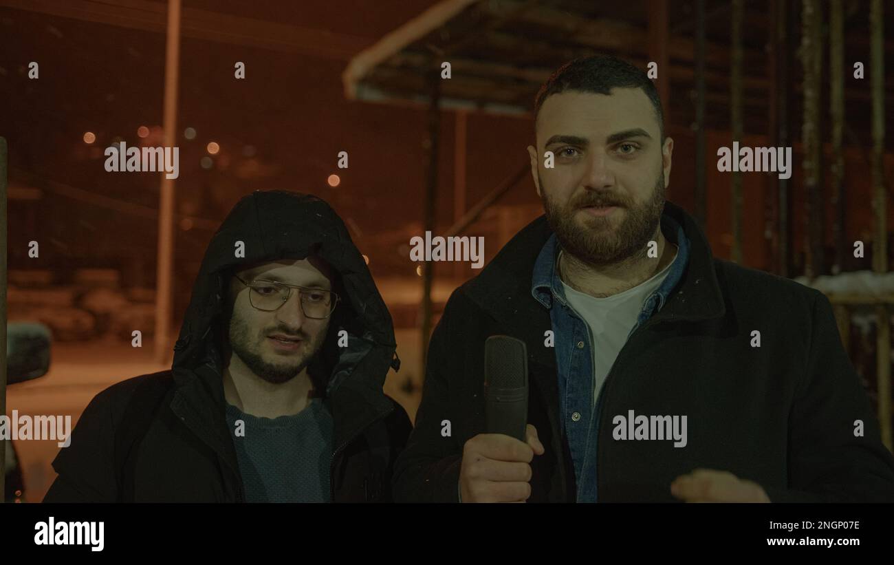 Journalist Interviews a Stranded Man in a Harsh Winter Landscape Stock Photo - Alamy