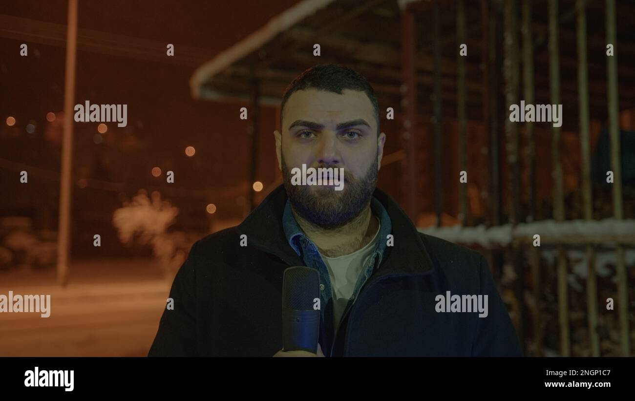 Bearded, Broad-Shouldered Male Reporter Delivering Bad News in Snowy ...