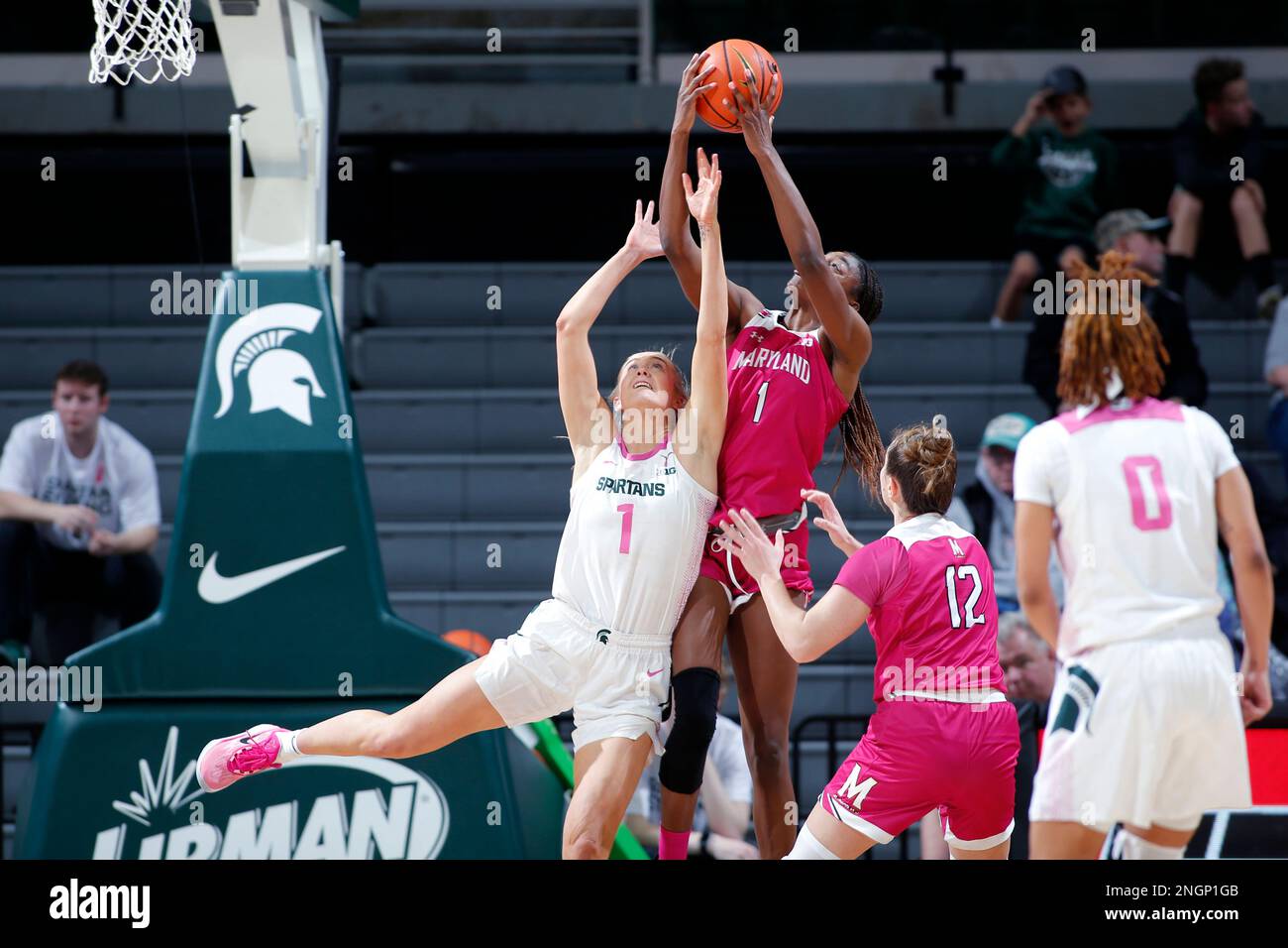 Michigan State's Tory Ozment, left, and Maryland's Diamond Miller reach ...