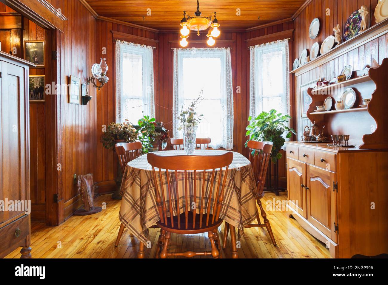 Antique oval shaped wooden table with high back chairs, buffet in ...