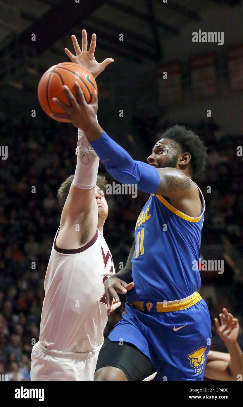 Virginia Tech's Grant Basile, left, defends as Pittsburgh's Jamarius ...
