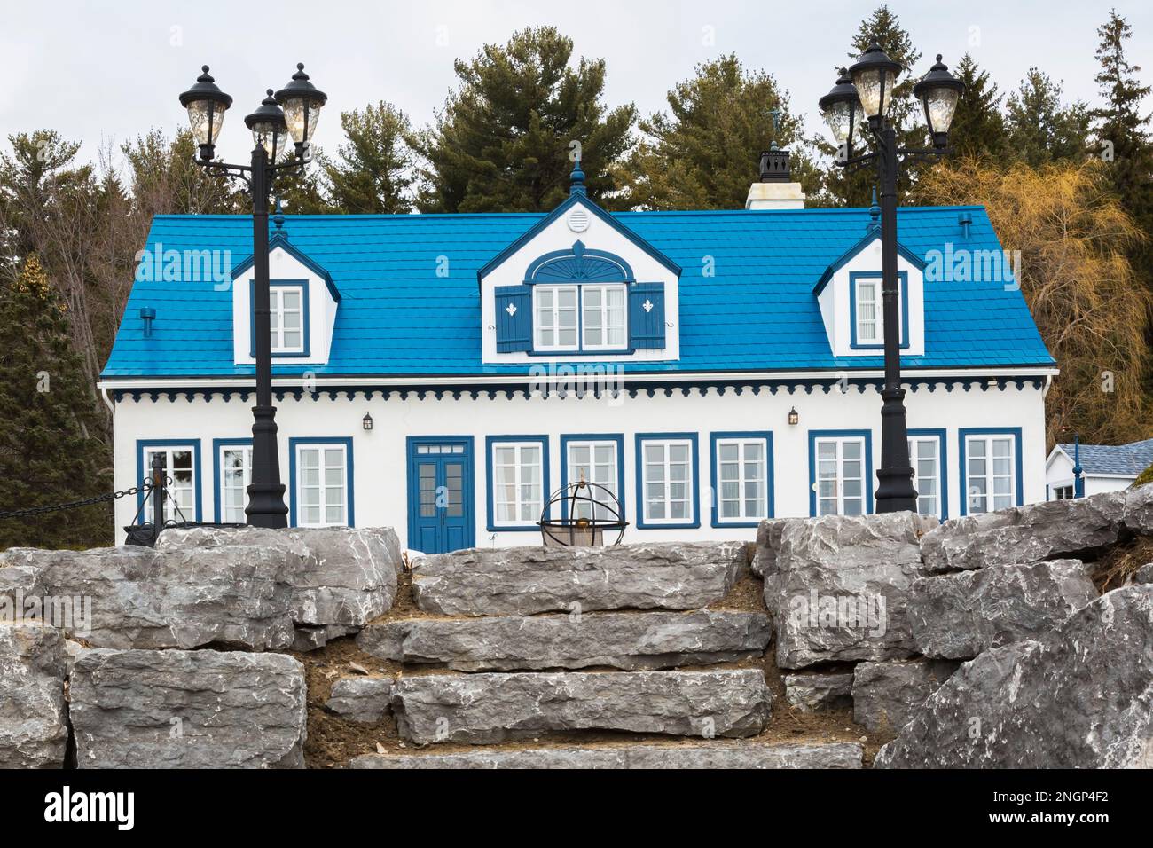 Back view of old 1920s white roughcast with blue trim cottage style ...