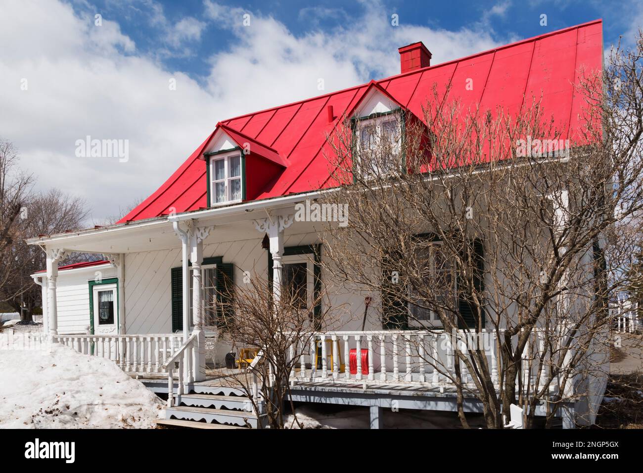 Old 1835 white wood plank with green trim house facade with red sheet ...