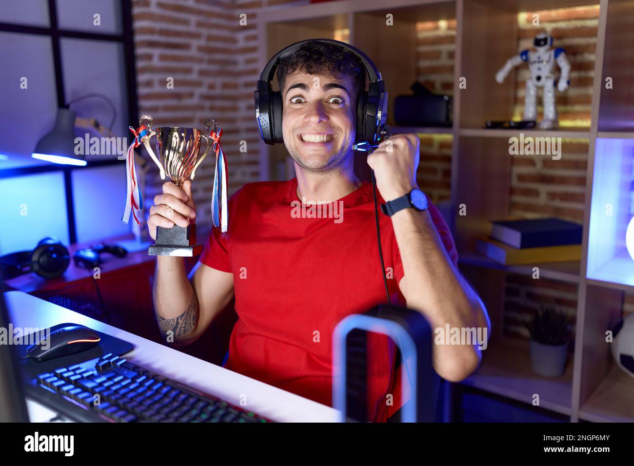 Excited player celebrating cyber success hi-res stock photography and ...